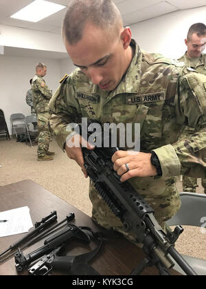 U.S. Army Spc. Justin Farfan assembles a Joint Chemical Agent Detector ...