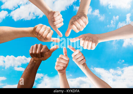 business team showing thumb up while sitting at the office Stock Photo ...