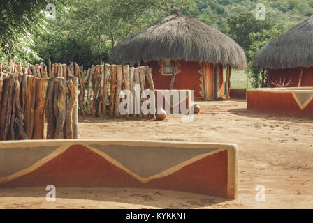 Traditional african round clay house with thatched roof in village ...
