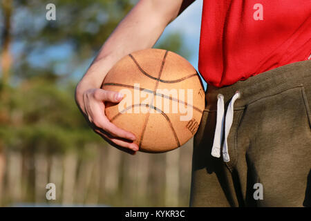 basketball hold by one hand Stock Photo - Alamy