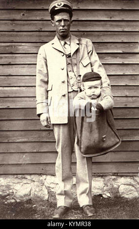 A black-and-white photograph of a letter carrier delivering mail by ...