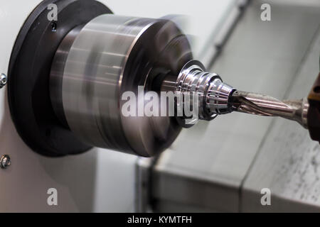 workpiece rotating in a CNC lathe machine : Side view Stock Photo - Alamy