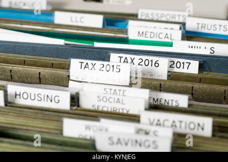 Home filing system for taxes organized in folders Stock Photo - Alamy