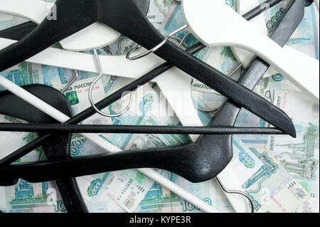 Russian rubles and empty clothes hangers in the wardrobe Stock Photo ...