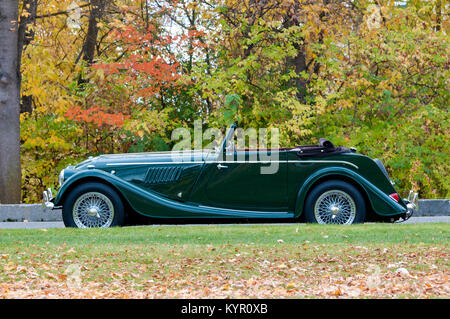 British racing green Morgan Plus Four car parked on display at a Super ...