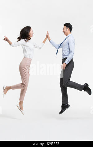 Businessman jumping high Stock Photo - Alamy