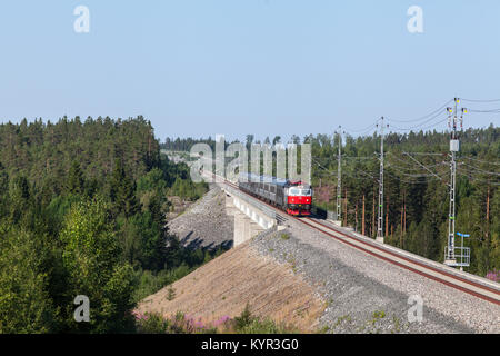 BOTHNIA LINE, SWEDEN ON JULY 24, 2014. Night train heading north. High ...