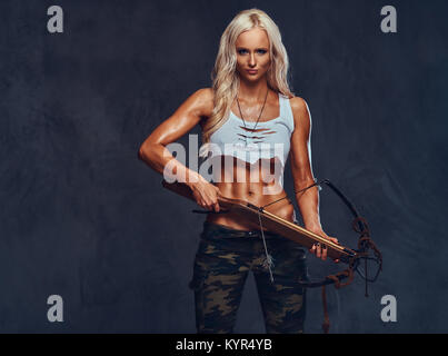 A woman holds crossbow Stock Photo - Alamy