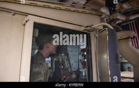 A Husky vehicle mounted mine detector Mk III is loaded onto a C-17 ...