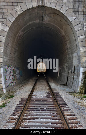 light on end of train tunnel representing new life and success concept ...