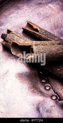 cinnamon sticks on old rust background in rustic style Stock Photo - Alamy