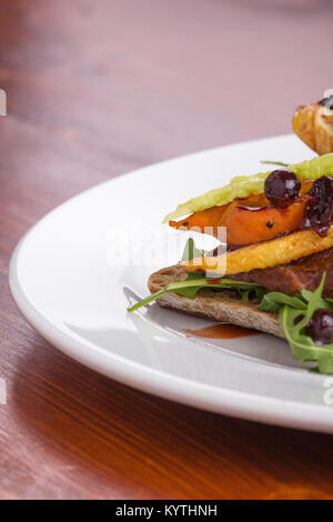 Roasted beef chick on a toast served with sauted carrot Stock Photo - Alamy