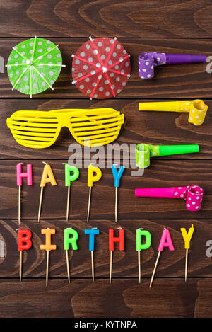 Birthday accessories on color wooden background. Birthday party ...