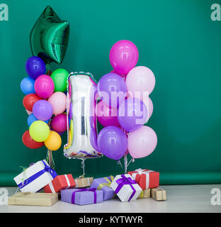 balloons of different colors with gifts for the holiday Stock Photo - Alamy
