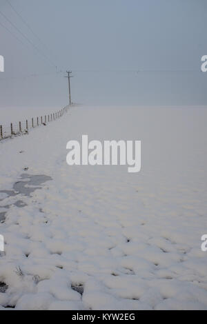 Empty fields scottish highlands during snow and mist Stock Photo - Alamy