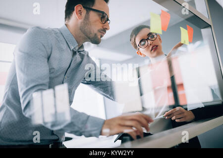 Corporate teamworking young colleagues in modern office Stock Photo - Alamy