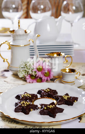 a dessert in the form of a piece of brownie cake served on the table ...