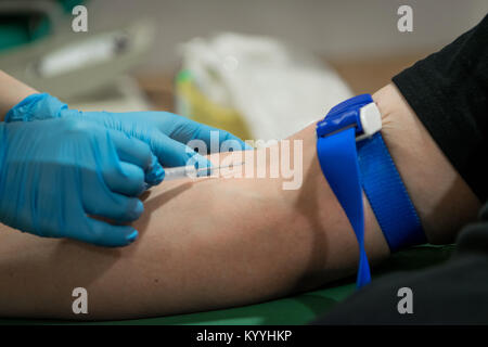 Process of giving blood including syringe injection Stock Photo - Alamy