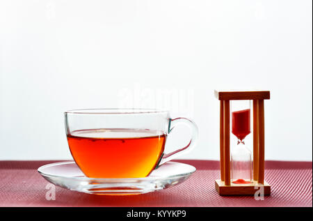 hourglass and tea Stock Photo - Alamy