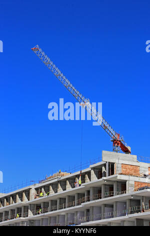 Crane working on construction site Stock Photo - Alamy