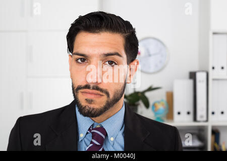 Portrait of spanish man who is indignant at work in office Stock Photo ...