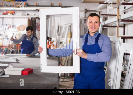 vigorous professional labours with finished PVC profiles and windows at ...