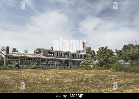 Abandoned crumbling old factory building closeup in sunny day Stock ...