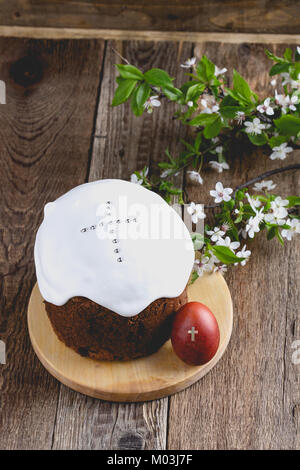 Easter cake, painted egg and blooming branch, spring composition on ...