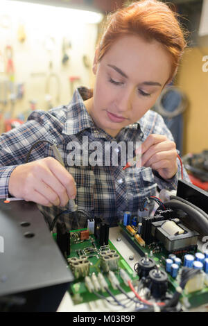 Female computer engineer - woman repair hard disc, sterile Stock Photo ...