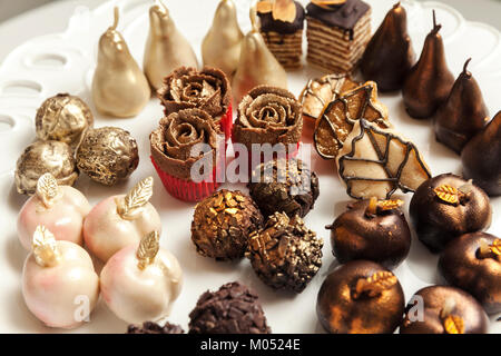 expensive small cakes made in the form of fruit Stock Photo - Alamy