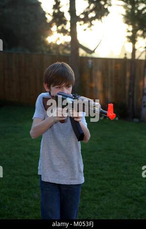 Boy with a weapon Stock Photo - Alamy