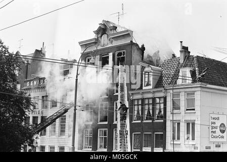 The image shows a fire in an Amstel canal house in Amsterdam, with ...