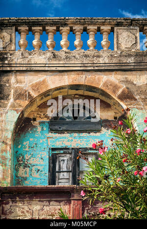 Traditional house detail in Malta. Limestone yellow bricks and colorful ...