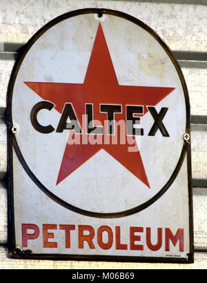 This enamel advertising sign from Caltex Garage, a well-known global ...