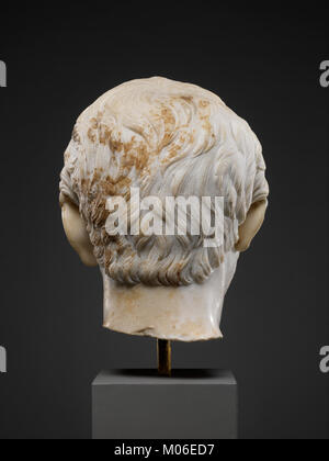 This marble portrait of a man demonstrates detailed sculptural ...