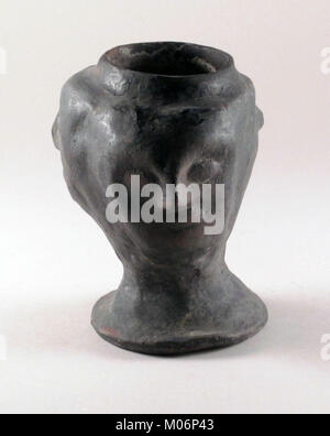 This jug, a typical example of period ceramic craftsmanship, was ...