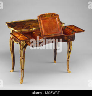 This mechanical table demonstrates intricate design and engineering ...
