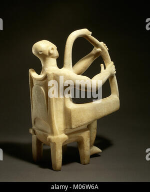 A marble sculpture depicting a seated harp player, showcasing intricate ...