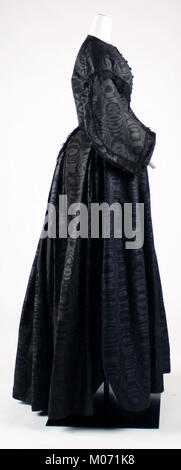 A mourning ensemble of garments and accessories used in funeral rituals ...