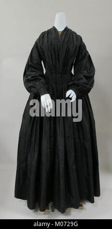 This mourning dress, designed in the late 19th century, represents ...