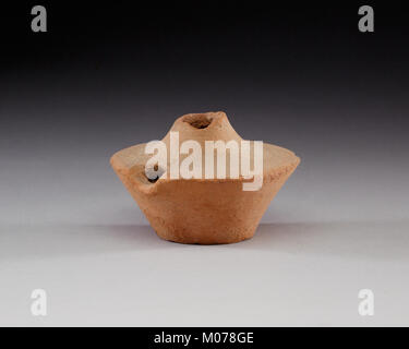 This lamp, part of the MET collection, features a detailed design that ...