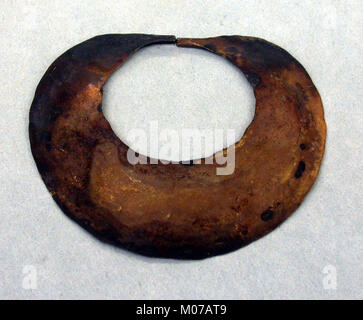 A decorative nose ornament, likely from a historical or cultural ...