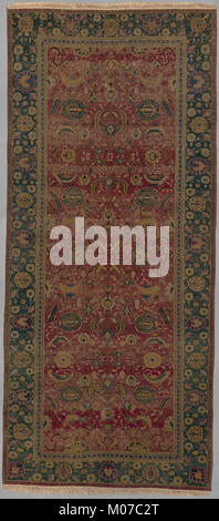 This Indo-Persian carpet displays intricate vine scrolls and palmettes ...