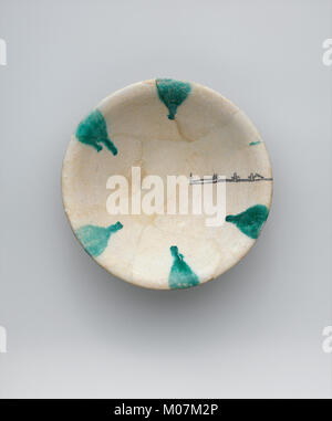 This imitation green-splashed Samarra ware piece reflects the intricate ...