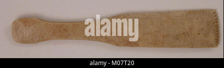 This loom or carding tool, used in textile production, provides insight ...