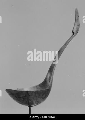 This ladle is a historical utensil designed for serving, featuring ...