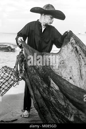 Unrecognizable fishermen catching fish in sea Stock Photo - Alamy