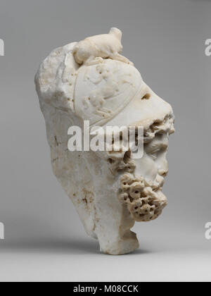 This marble relief fragment features the head of Mars, the Roman god of ...