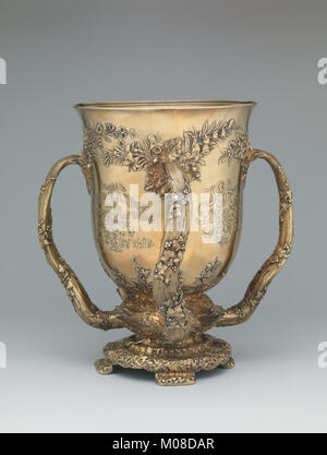 A finely crafted collection cup used in historical rituals or daily ...