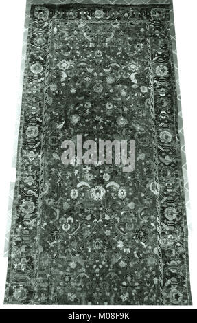 This carpet features an intricate vine scroll and palmette pattern ...